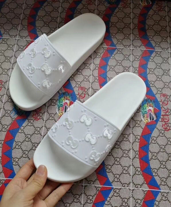 Gucci Unisex rubber GG slide sandal White - AlimorLuxury